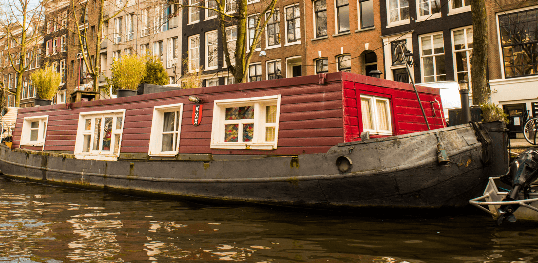 Waterpeil in Amsterdam verlaagd voor verplaatsing woonboot - BootAanBoot.nl